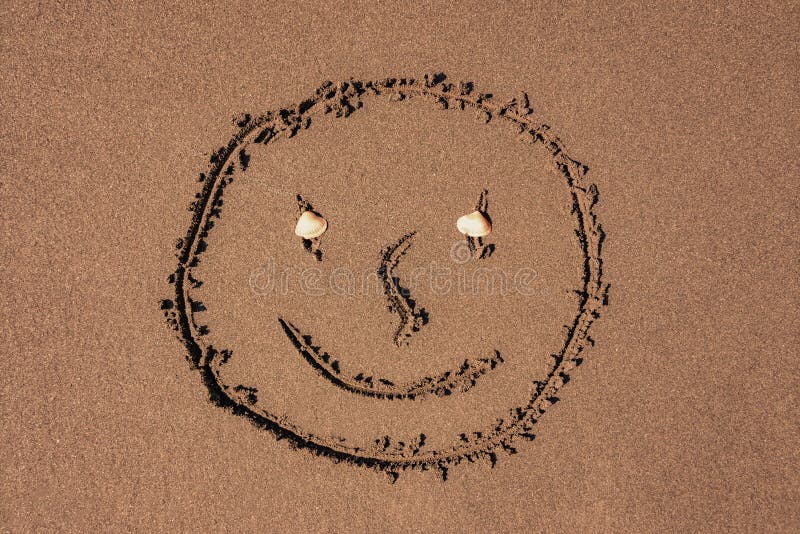 A Sad Face on the Sand of Small Seashells Inside a Pile of Rubbish ...