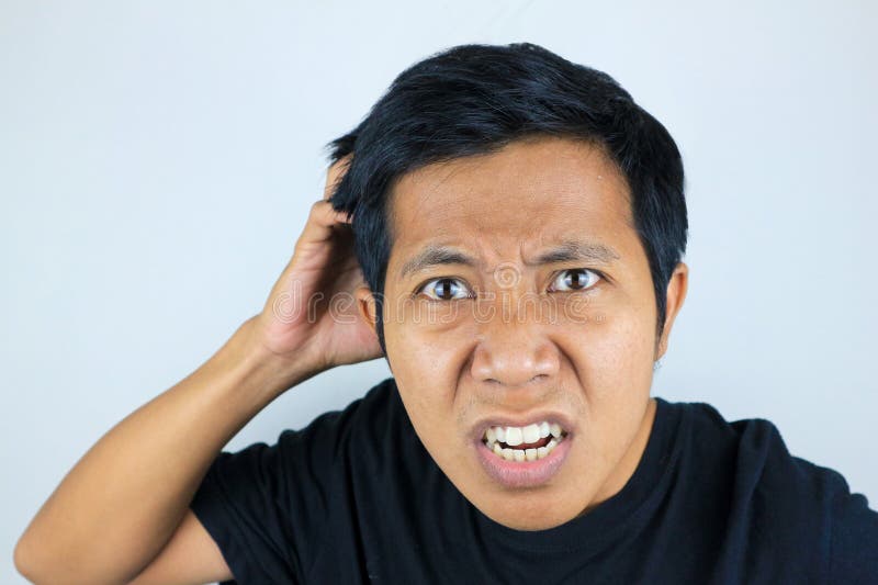 Funny Facial Expression of Asian Man Confused and Scratching His Head ...