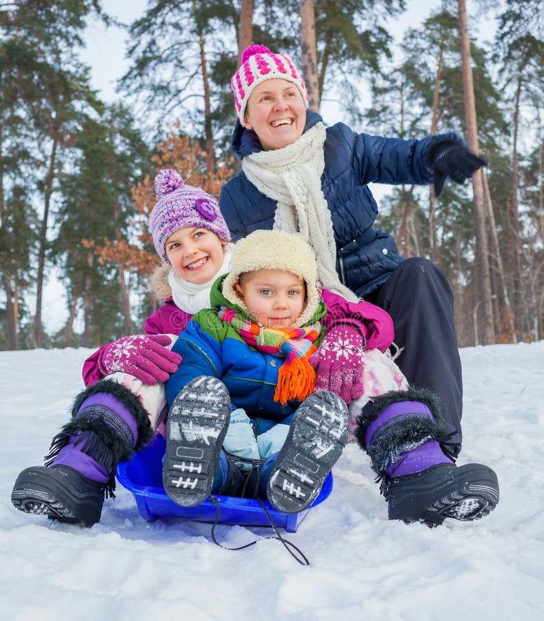 Funny Family is Sledging in Winter-landscape Stock Photo - Image of ...