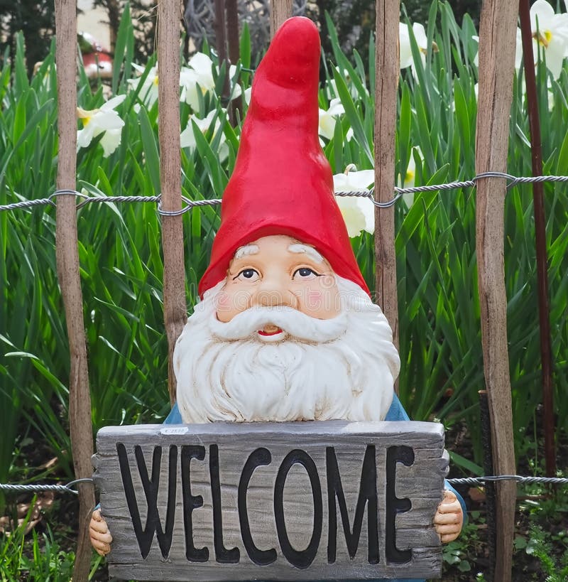 Funny Garden Dwarf with a Red Pointed Hat Holding a Welcome Sign Stock ...