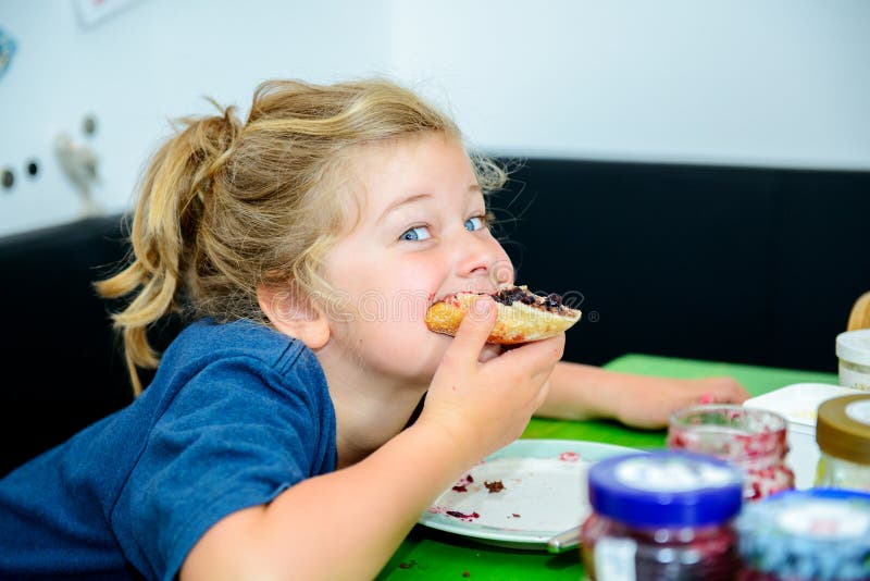 Funny Girl Eating Bread Roll with Marmelade Stock Image - Image of ...