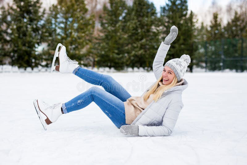 Girl Falling Down while Ice Skating at Winter Rink Stock Photo - Image ...