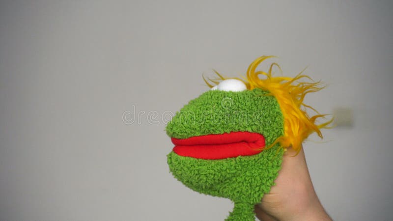 Funny green puppet walking stock footage. Video of concept - 84792130