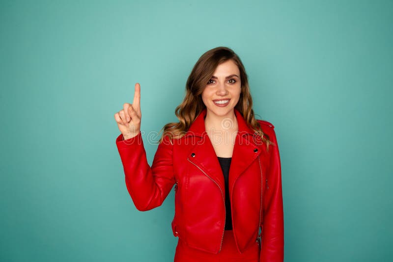 Funny and Handsome Female Pointing Somethng Up by Finger in a Studio ...