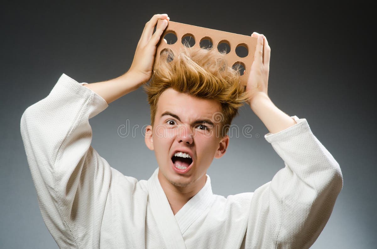 Funny Karate Man Breaking Bricks Stock Photos - Free & Royalty-Free ...