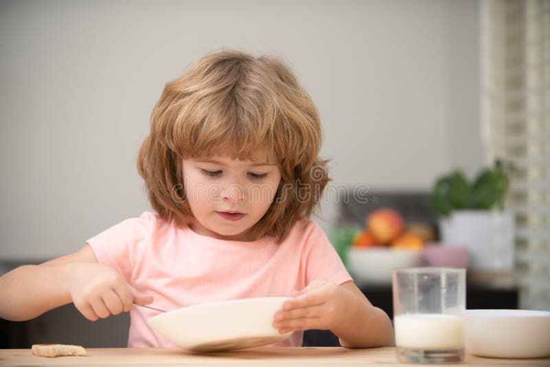 Funny Kid with Plate of Soup. Child Eating Dinner. Stock Photo - Image ...