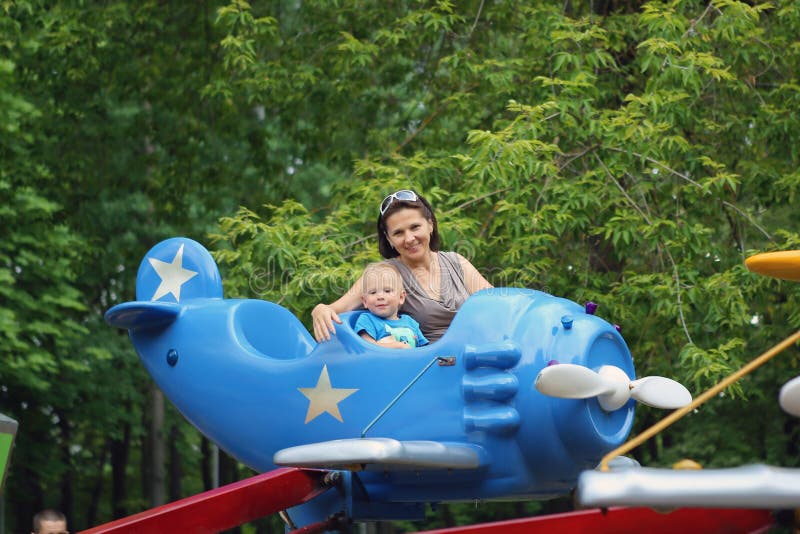 Funny Kid Riding an Amusement Park Ride Stock Photo - Image of little ...