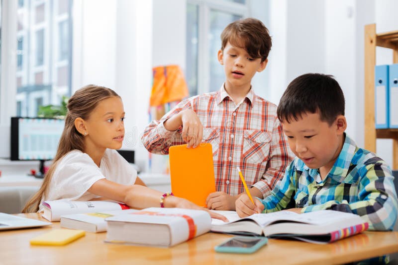 Funny Kids Doing Their Homework in a Classroom Stock Image - Image of ...