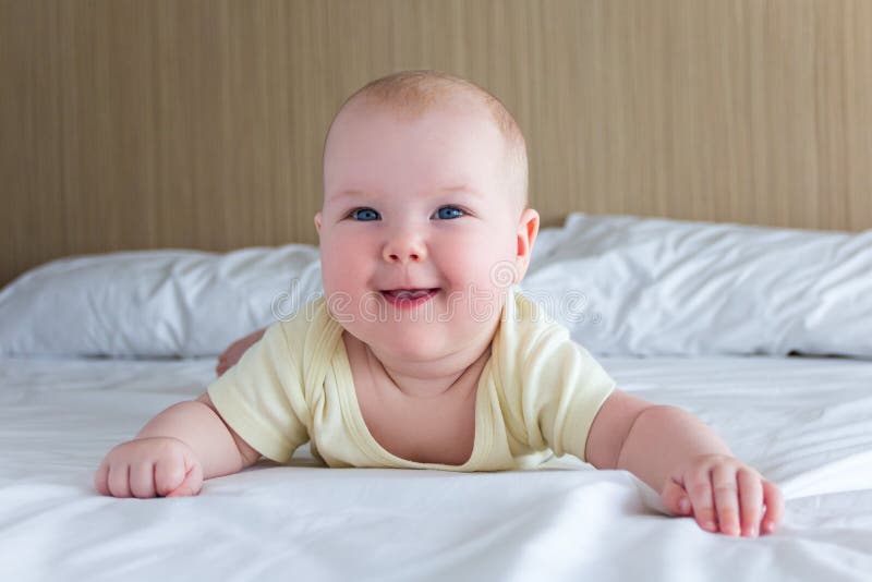 Funny Little Baby Lying on the Bed Stock Photo - Image of cute, pillow ... Funny Little Baby Lying on the Bed Stock Photo - Image of cute, pillow ...
