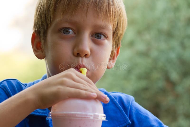 Funny Little Boy Drinks Milkshake Stock Image - Image of childhood ...