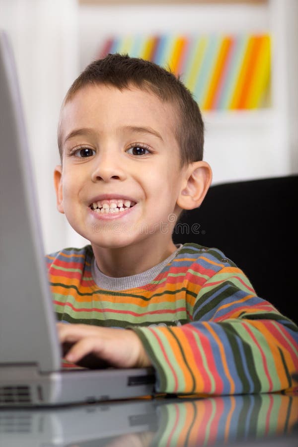 Little Boy with Laptop Shows Stock Photo - Image of primary, lifestyle ...