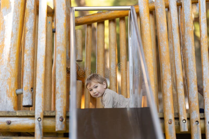 Funny Little Boy on Playground - Looking in the Camera from the ...