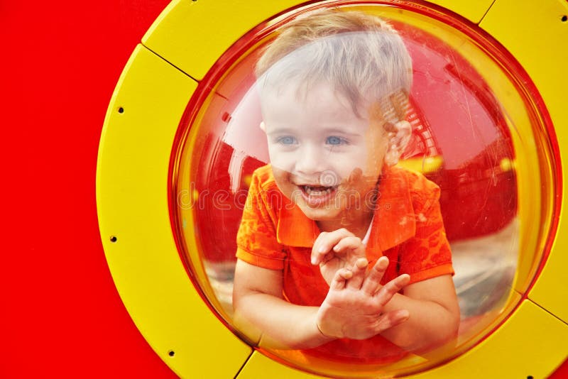 Funny Little Boy on Playground. Playing Child on Slide. Stock Image ...