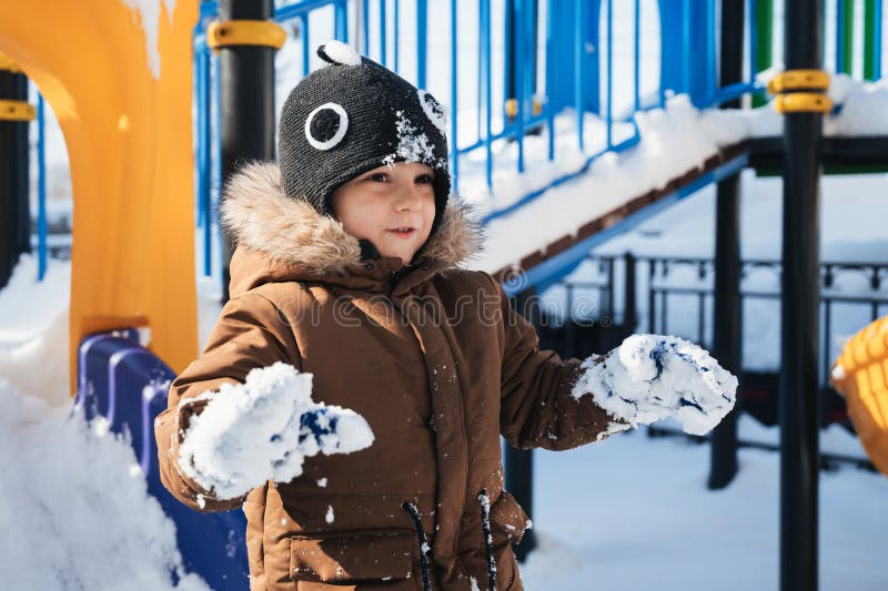 Funny Little Boy Playing in Snow, Outdoors in Winter. Stock Image ...
