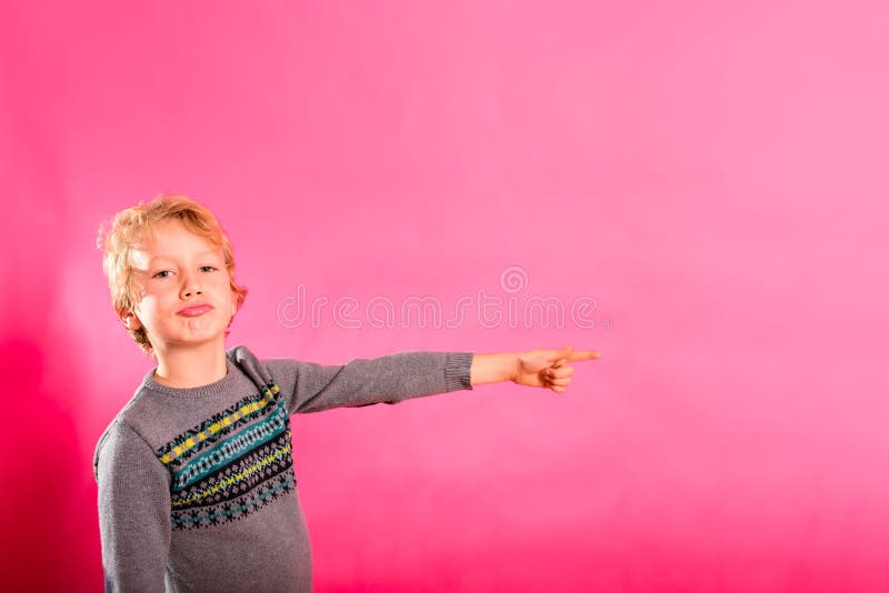 Funny Little Boy Points His Finger Forward while Laughing, Isolating on ...