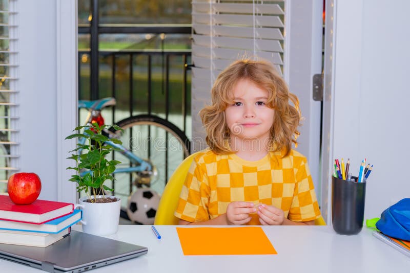 Funny Little Child from Elementary School Doing Homework Writing at ...