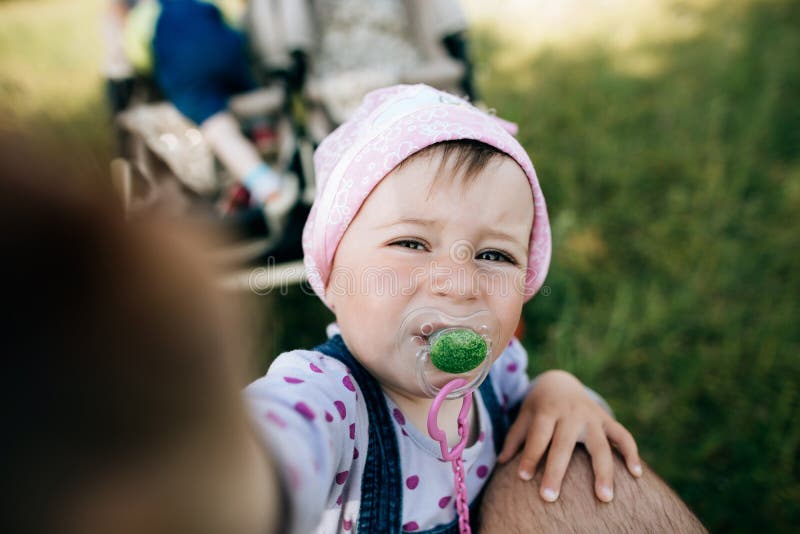Funny Little Girl with a Pacifier in Her Mouth Stock Photo - Image of ...