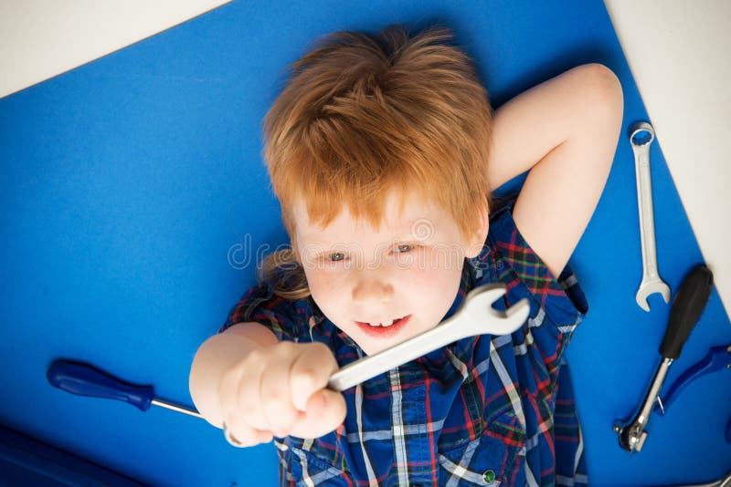 Funny little mechanic boy stock photo. Image of preschooler - 39121452