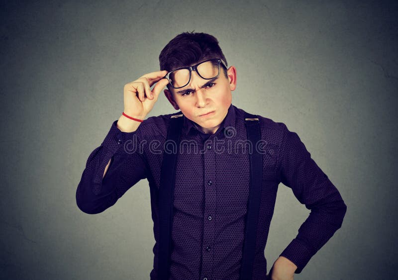 Funny Looking Skeptical Grumpy Young Man Glasses Stock Photos - Free ... Funny Looking Skeptical Grumpy Young Man Glasses Stock Photos - Free ...