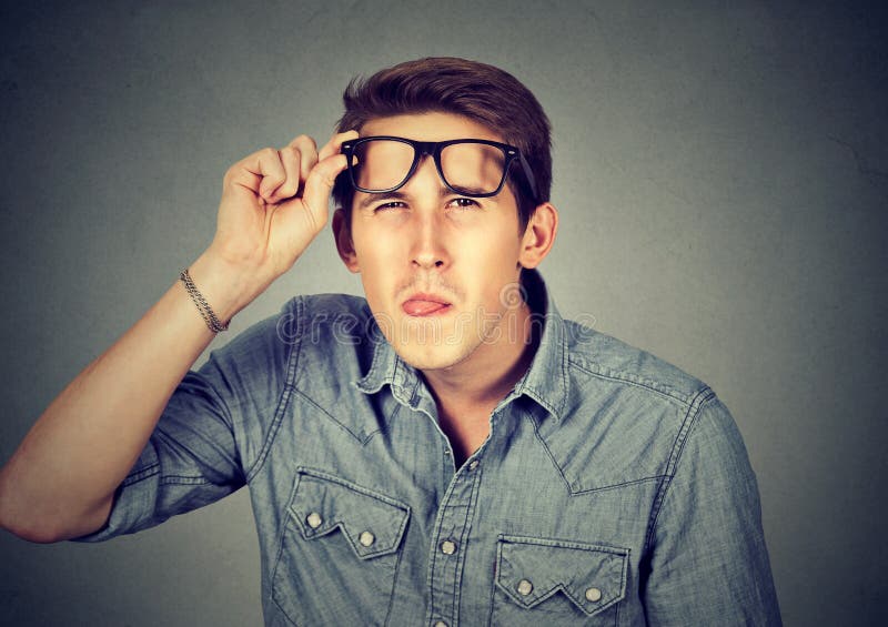 Funny Looking Skeptical Grumpy Young Man Glasses Stock Photos - Free ...