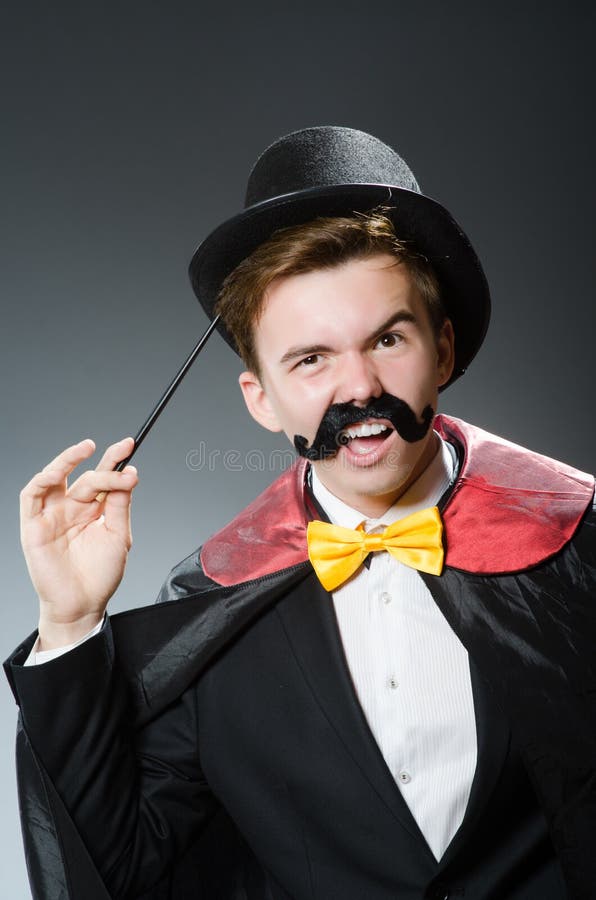 Funny magician with wand stock photo. Image of entertainment - 45046848