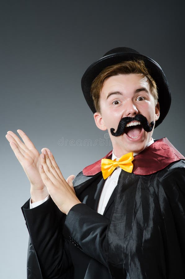 Funny magician with wand stock photo. Image of circus - 46294838