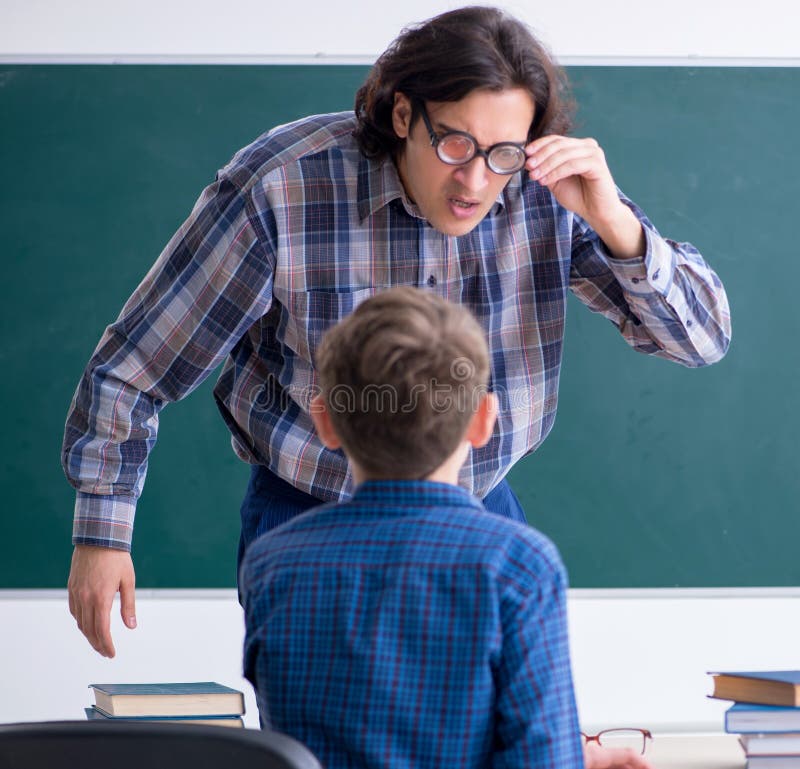 Funny Male Teacher and Boy in the Classroom Stock Photo - Image of ...