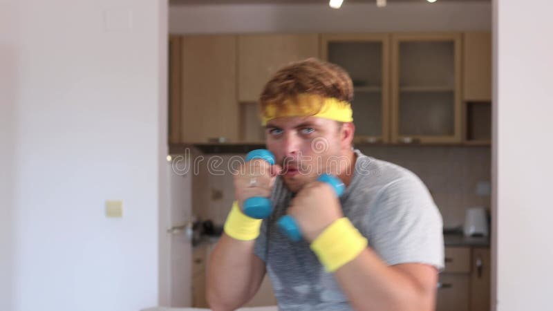 Funny Man Boxing with Dumbbells. a Parody of Boxing Training Stock ...