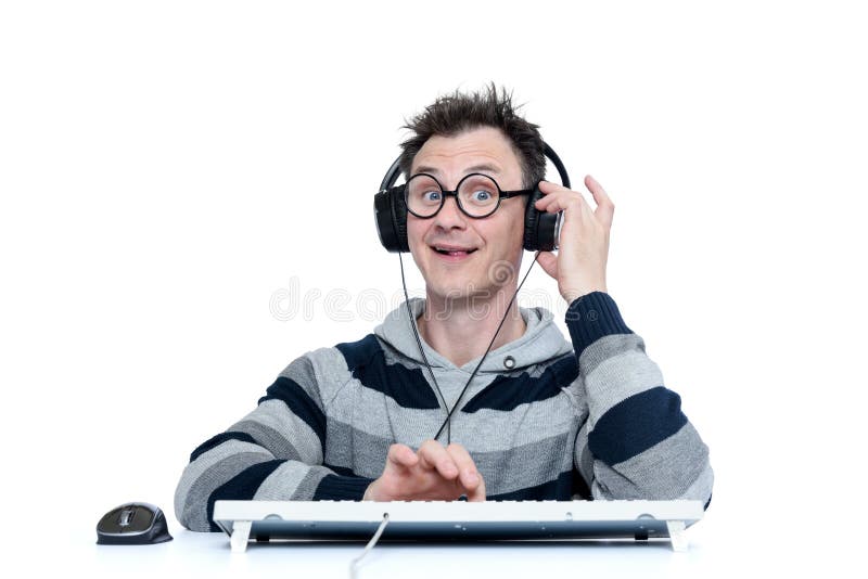 Funny Man in Glasses and Headphones with Keyboard in Front of Computer ...