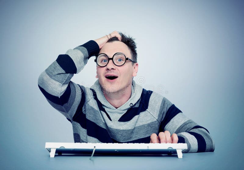 Funny Man in Glasses with Keyboard in Front of Computer. Eureka! Stock ...