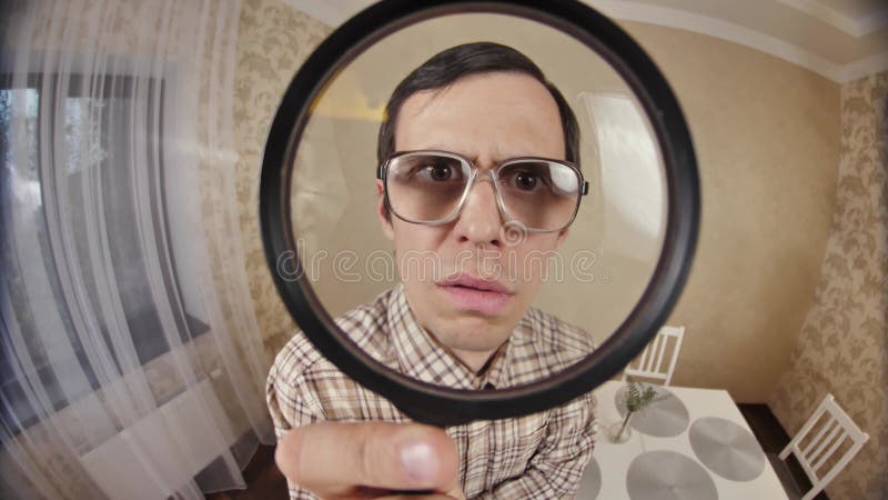 Nerd Looks through Magnifier Glass Stock Footage - Video of magnifying ...