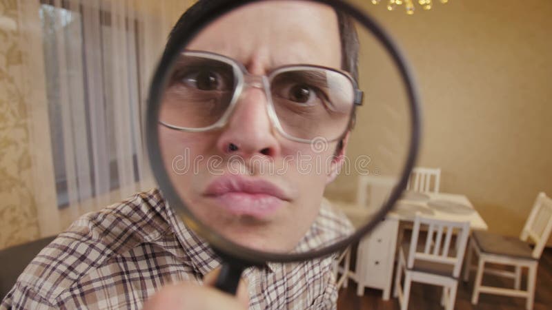Nerd Looks through Magnifier Glass Stock Footage - Video of magnifying ...