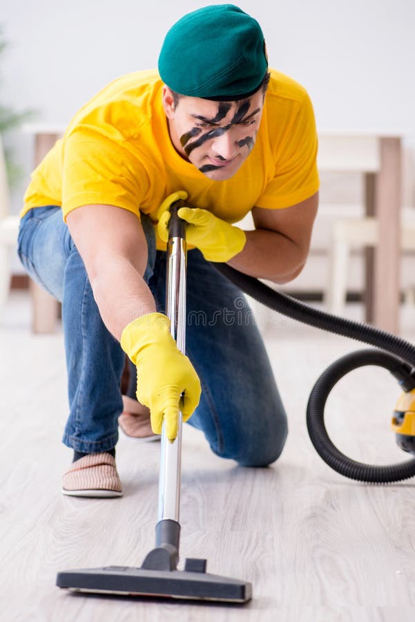 The Funny Man in Military Style Cleaning the House Stock Image - Image ...