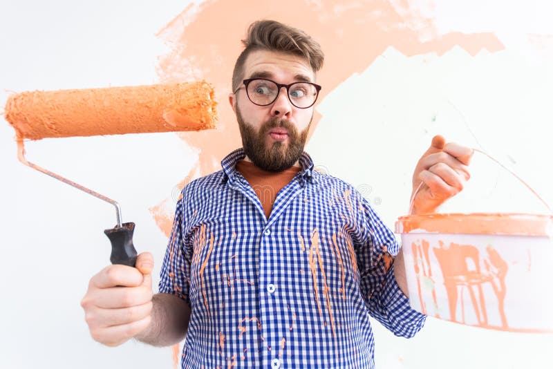 Funny Man Painting Interior Wall with Paint Roller in New House. Guy ...