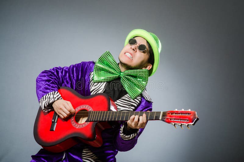 The Funny Man Playing Guitar in Musical Concept Stock Photo - Image of ...