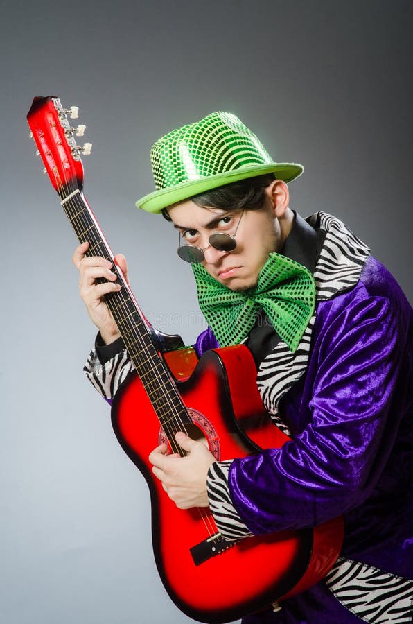 The Funny Man Playing Guitar in Musical Concept Stock Photo - Image of ...