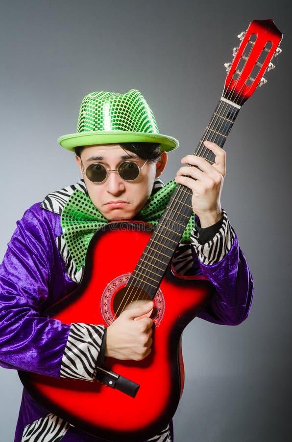 Funny Man Playing Guitar in Musical Concept Stock Image - Image of ...