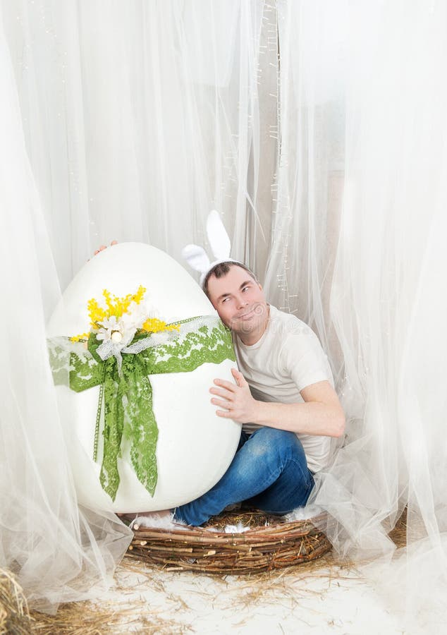 Funny Man with Rabbit Ears Sitting in the Nest Easter Holiday Concept ...