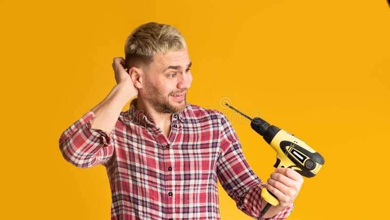 Man Scratches His Head and Looks at Drill Stock Image - Image of ...