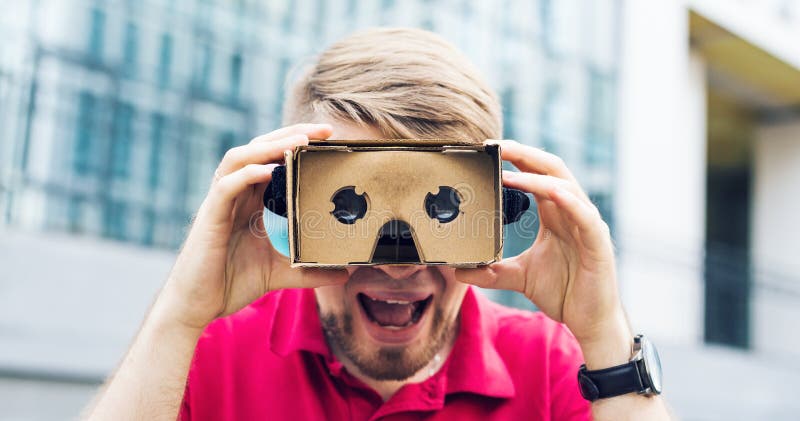 Funny Man Using Cardboard Virtual Reality Goggle Outdoors Stock Photo ...