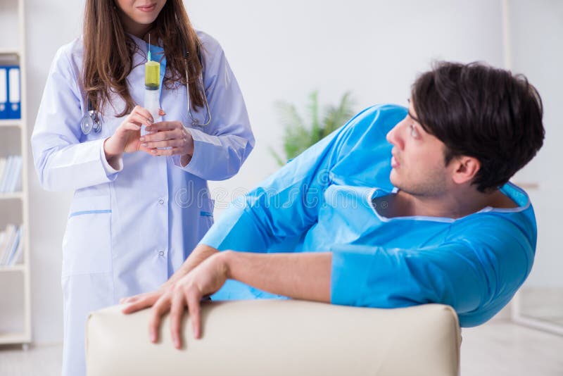The Funny Man Getting Ready for Buttocks Syringe Shot Stock Photo ...