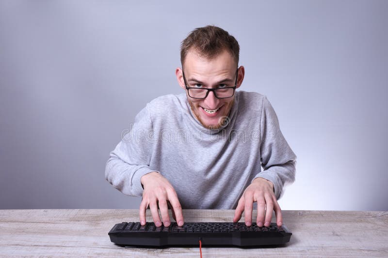 Funny Nerd Young Businessman, Man Working on Computer.Typing on the ...