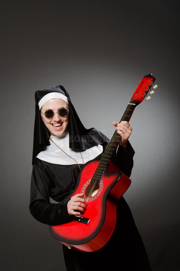 The Funny Nun with Red Guitar Playing Stock Image - Image of background ...