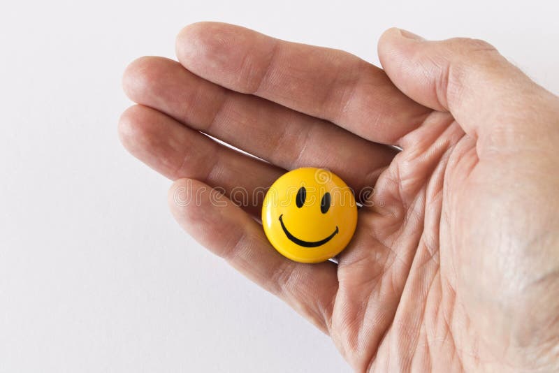 Funny Plastic Smiley Face in a Human Hand. the Concept of a Positive ...