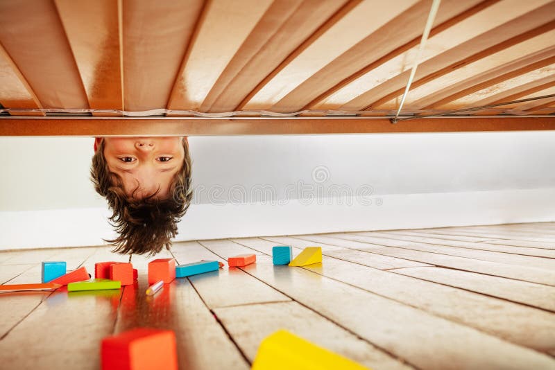 Funny Portrait of a Boy Look Down Under the Bed Stock Photo - Image of ...