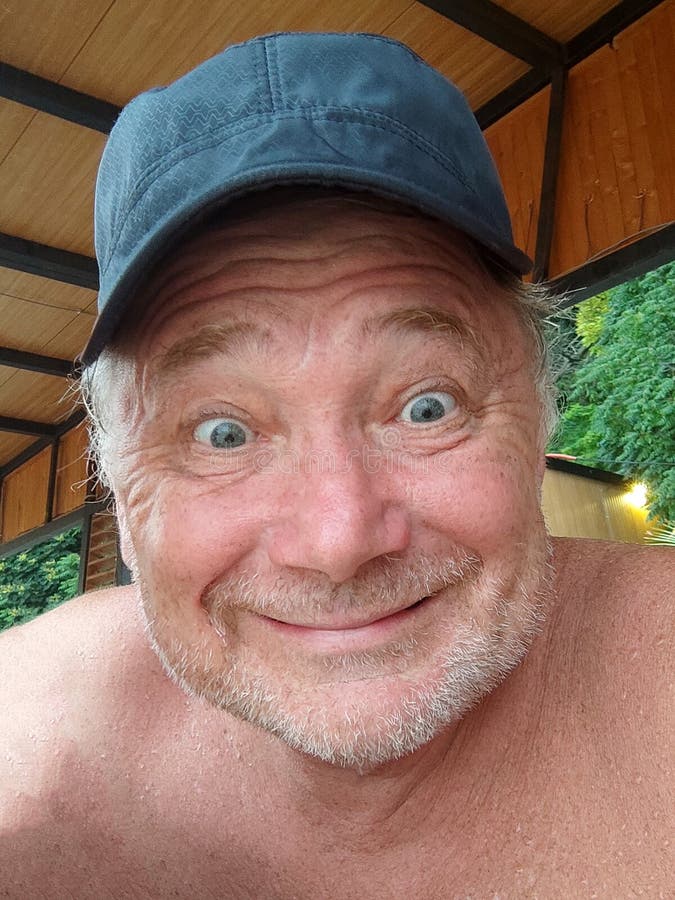 Funny Portrait of a Smiling Aged Man in a Cap with Bulging Eyes Stock ...