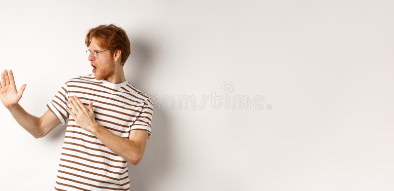 Funny Redhead Man Standing in Martial Arts Pose, Fighting Shadow and ...