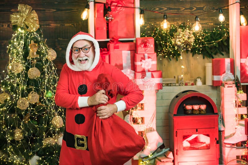Funny Santa Claus in Santa Hat. Santa with Christmas Gift. Stock Photo ...