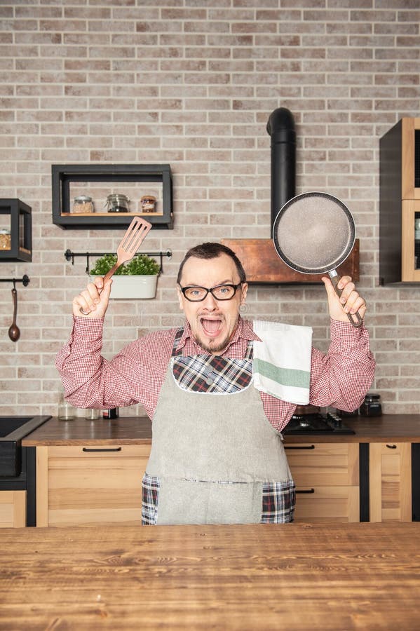 Funny Screaming Angry Man Wearing Pinafore with Kitchen Utensils Stock ...