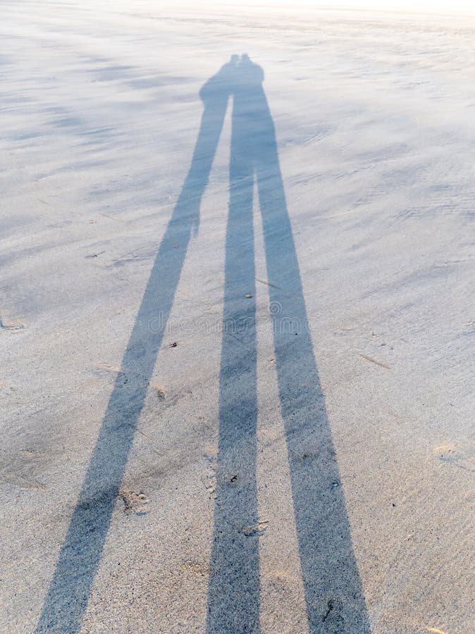 Funny Shadows of Couple on the Beach with Deep Sunlight Stock Photo ...